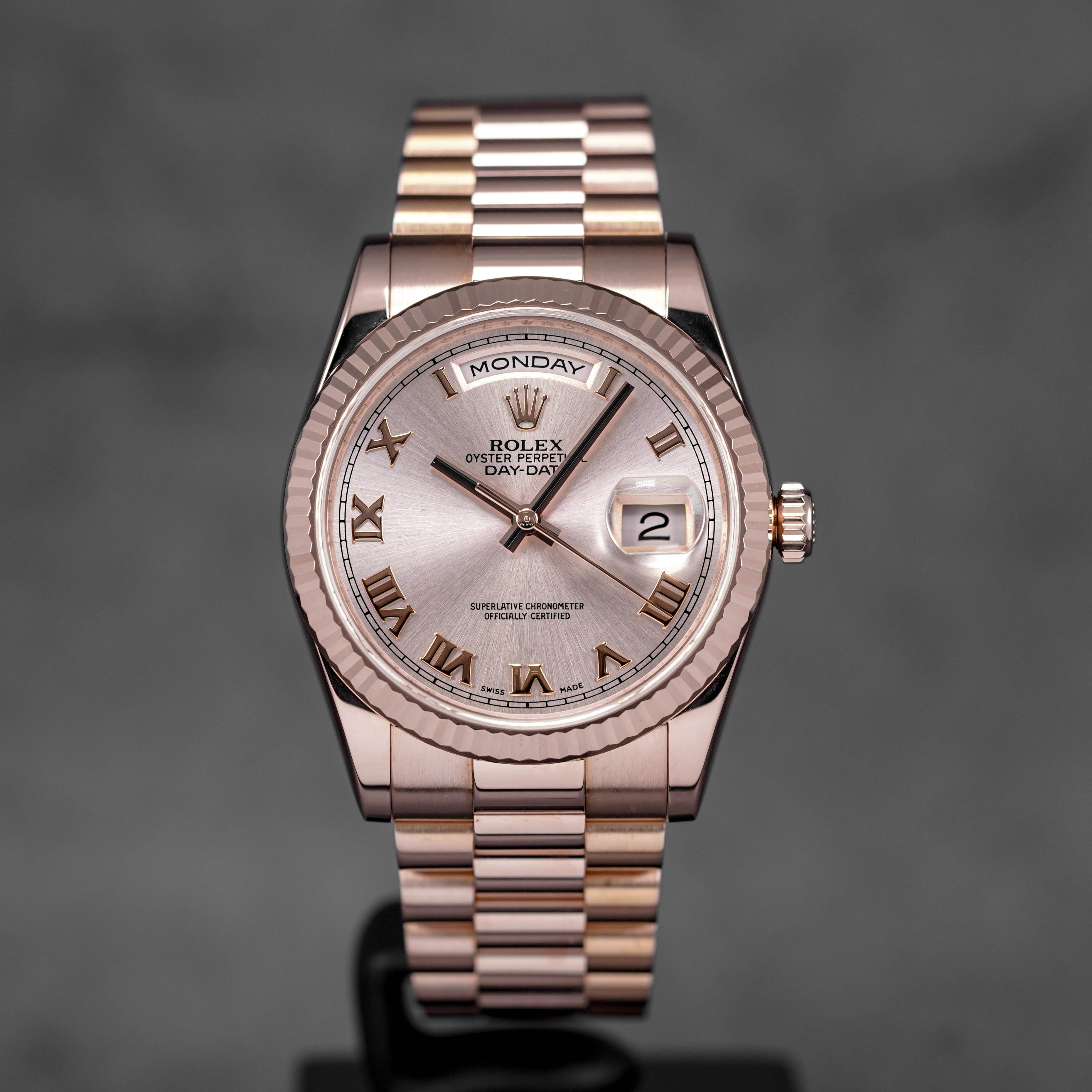 ROLEX DAYDATE 36MM ROSEGOLD PINK SUNDUST ROMAN DIAL (2013) - OMNILUXE